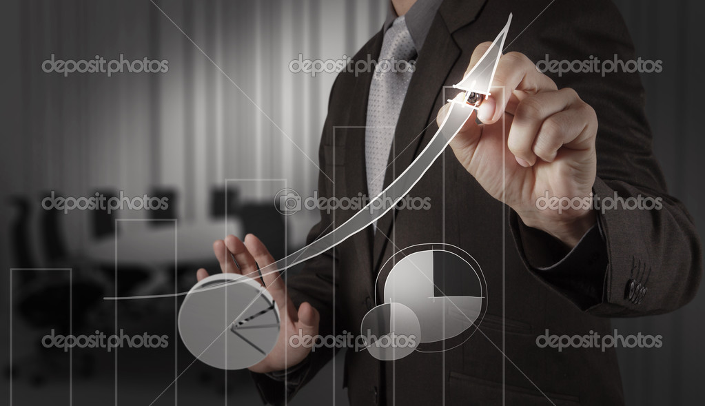 Businessman hand working with new modern computer and business s ...