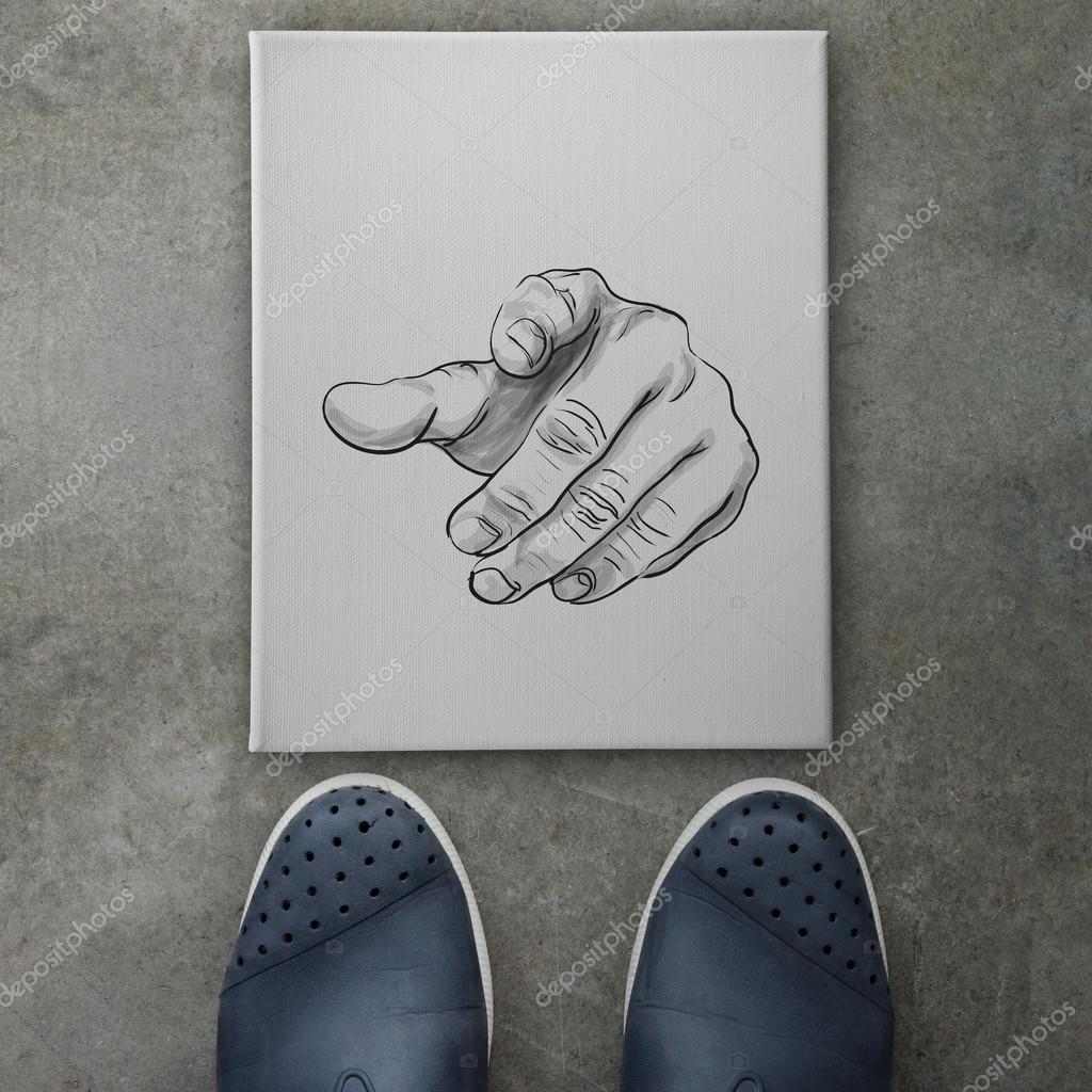 Hand drawn Human Hand Sign on front of business man feet as conc ...