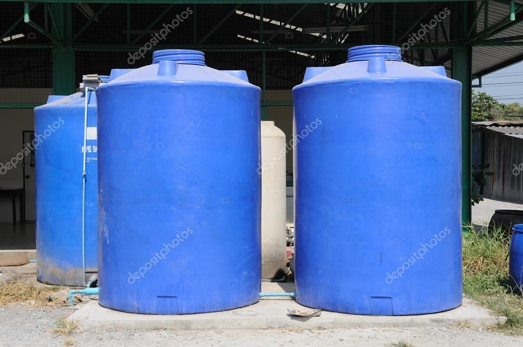 Big blue water plastic tank Stock Photo by ©ekarina 39401025