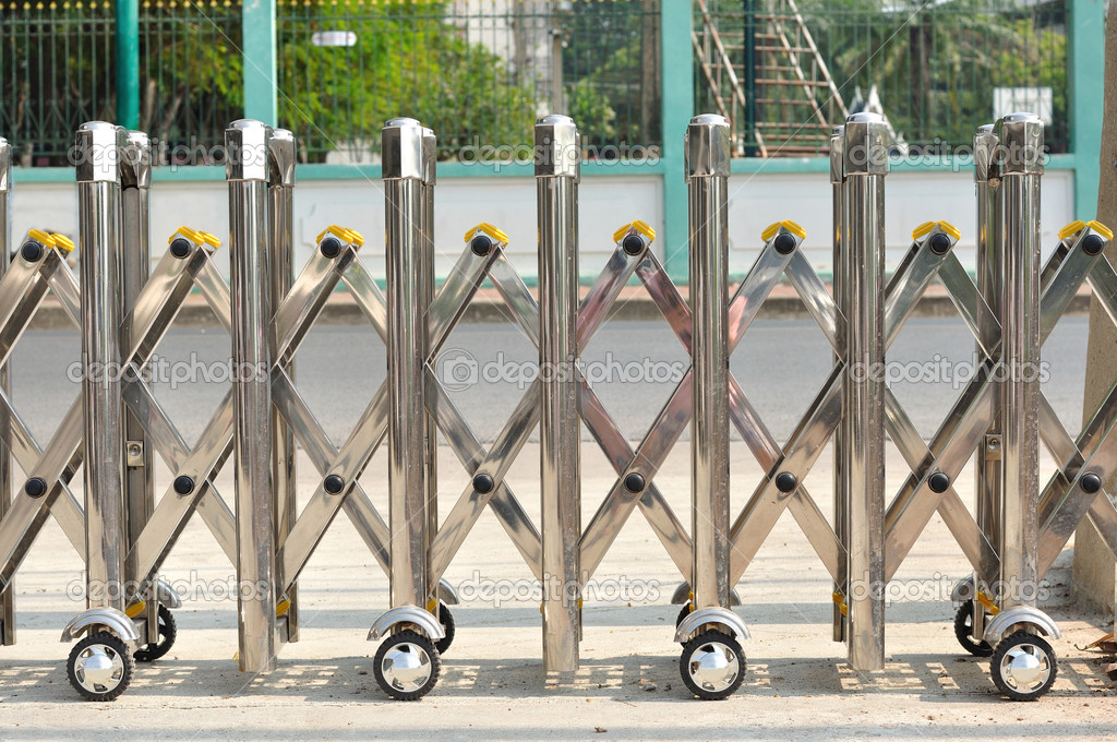 Iron sliding fence with wheel. — Stock Photo © ekarina #39403969