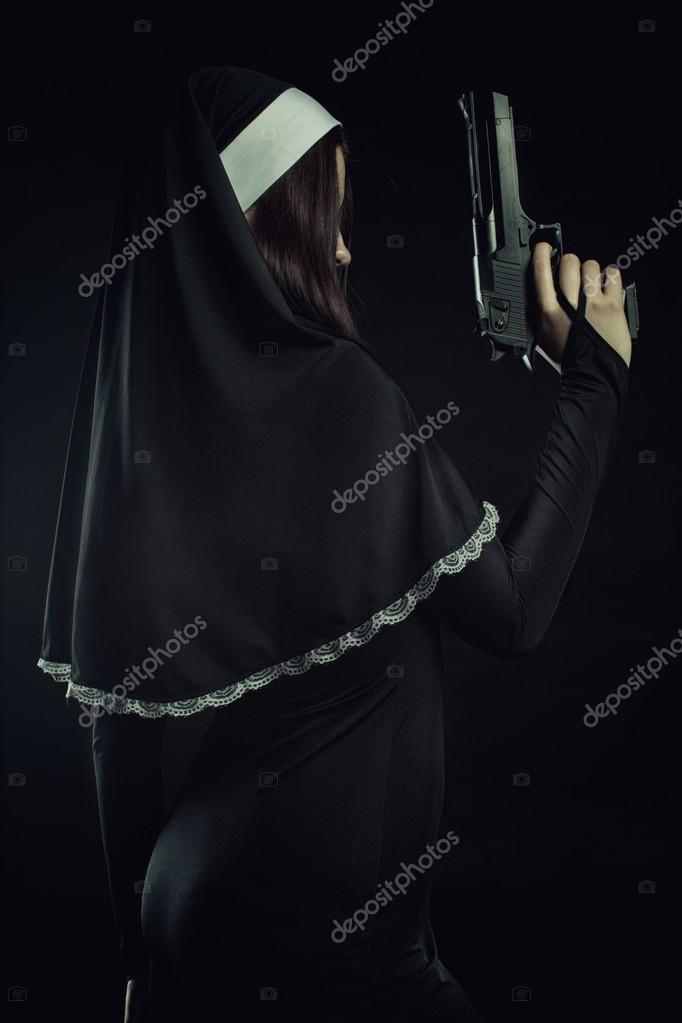 Nun with gun Stock Photo by ©igor_igorevich 50373991