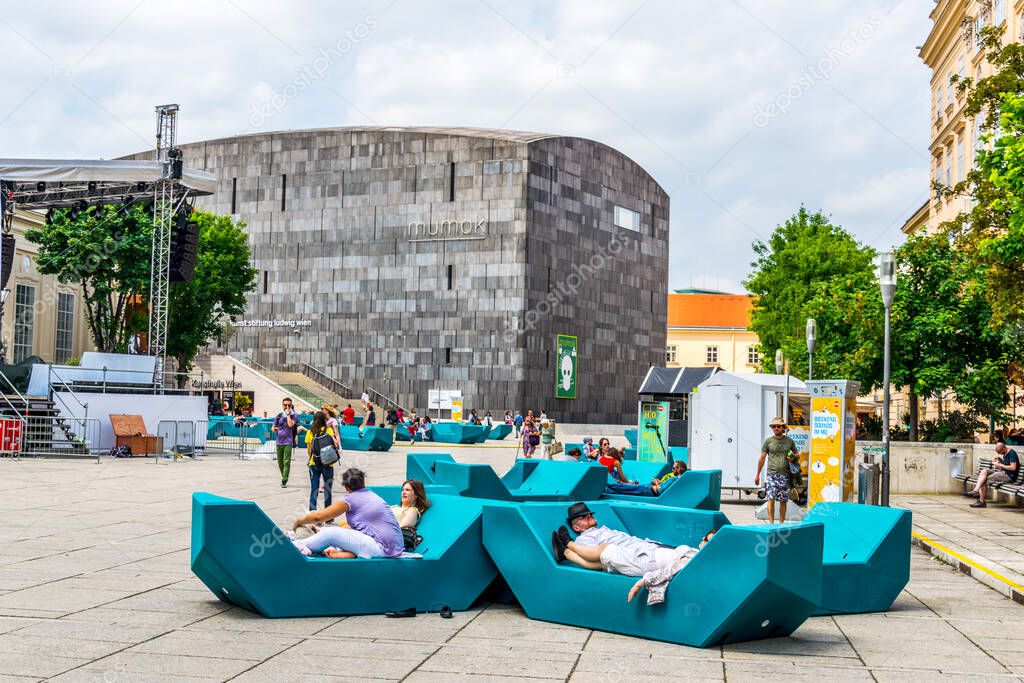 VIENNA, AUSTRIA, JUNE, 2016: Young people are chilling out on benches ...
