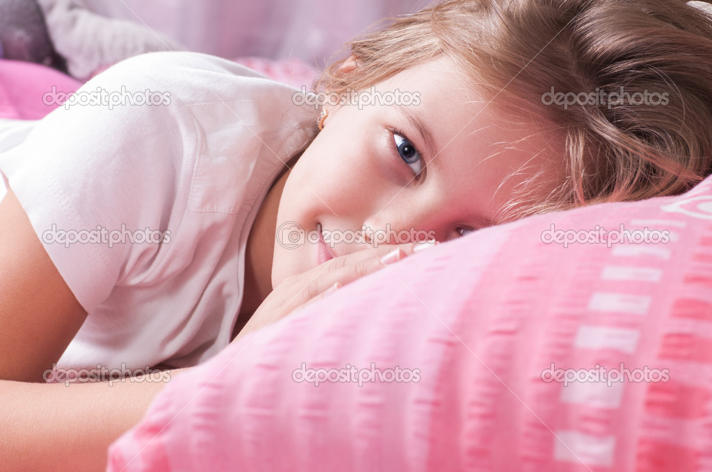 Beautiful girl in the pink sheets Stock Photo by ©baronb 17150849