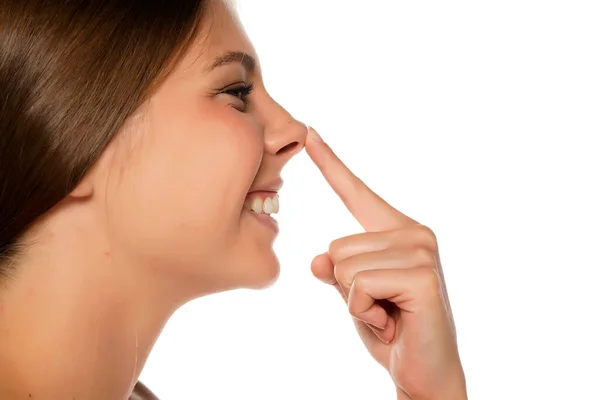 Young Serious Woman Touches Her Nose Her Fingers White Background ...