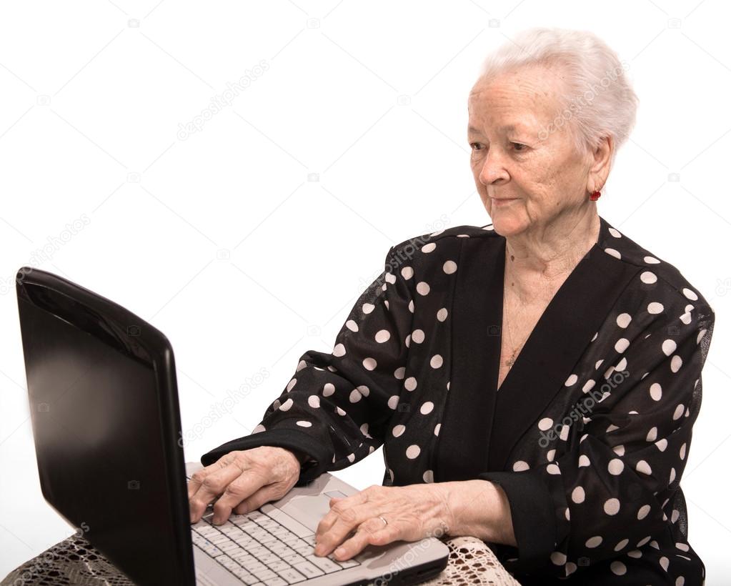 Old woman working on computer — Stock Photo © VBaleha #22194547