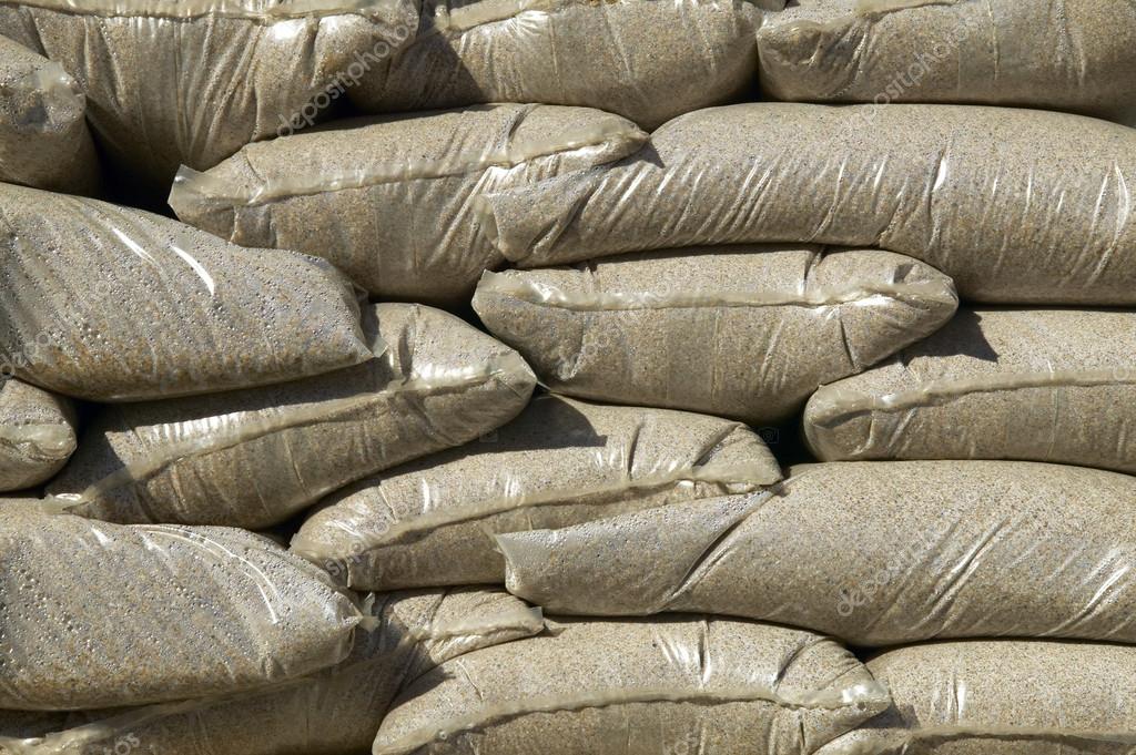Arena empaquetada en bolsas de plástico detalle: fotografía de stock ...