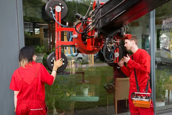 Glazier operating glass installation crane Stock Photo by ©Ikonoklast ...
