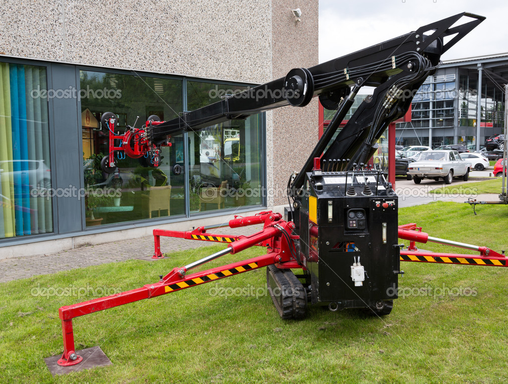 Glazier operating glass installation crane — Stock Photo © Ikonoklast ...