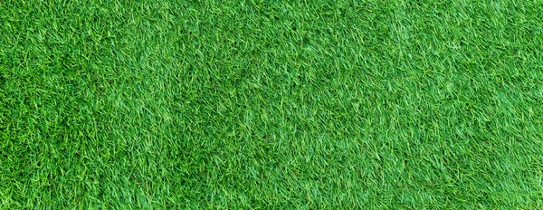 Panorama of green artificial turf flooring texture and background ...