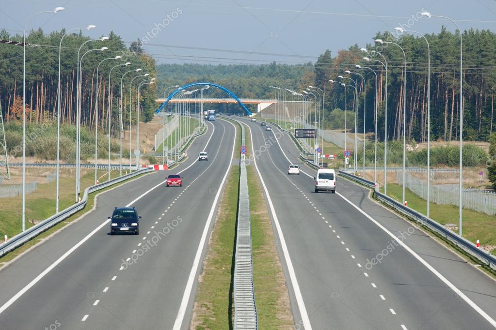 Two-lane highway with cars Stock Photo by ©bzyxx 37873365