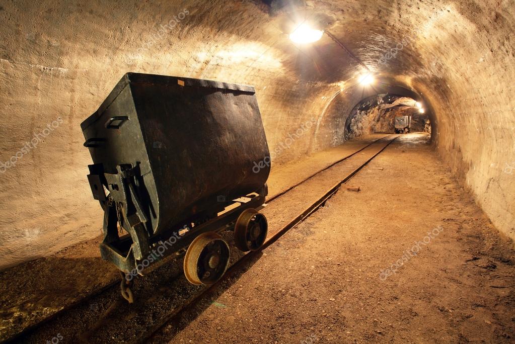 Underground train in mine, carts in gold, silver and copper mine ...