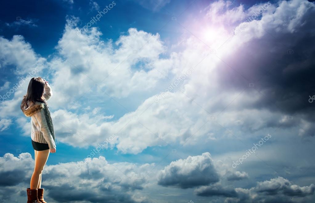 Little Girl Looking Up At The Sky