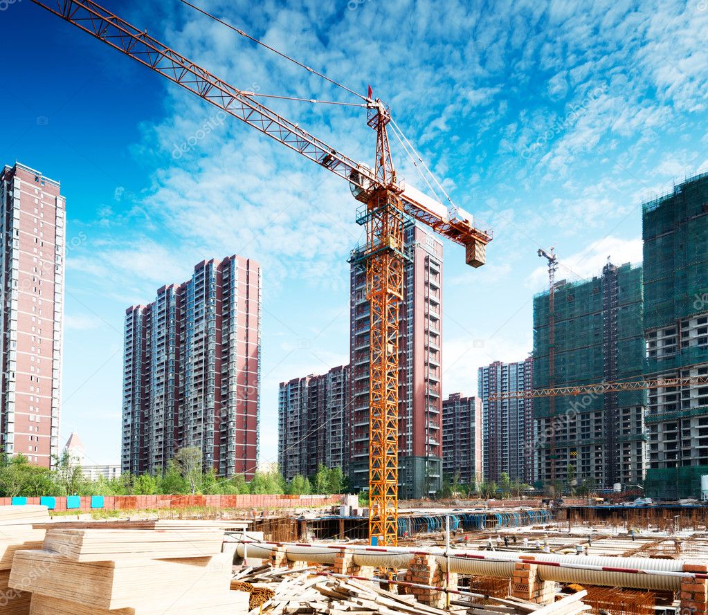 Multiple cranes working on huge construction site — Stock Photo ...