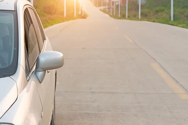 Angle shot of a car against sunset in the background - Stock Image ...