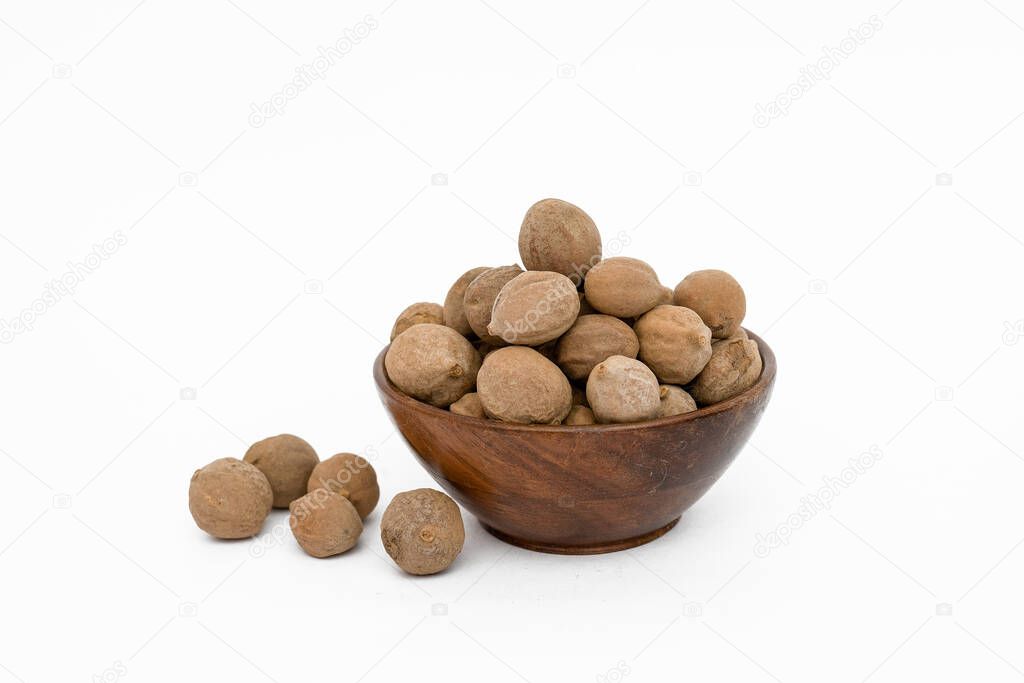medicinal bahera or Terminalia bellericais fruits on white background 2023