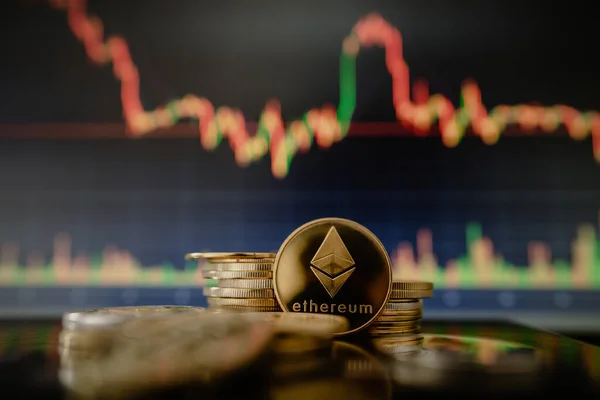 Stack or heap of gold Ethereum cryptocurrency with candle stick graph ...