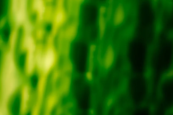Acid abstract background in green tones. A soft blur of bright fluidity ...