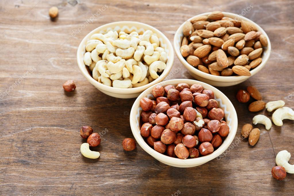 Three kinds of nuts in a bowl Stock Photo by ©olhaafanasieva 46693609