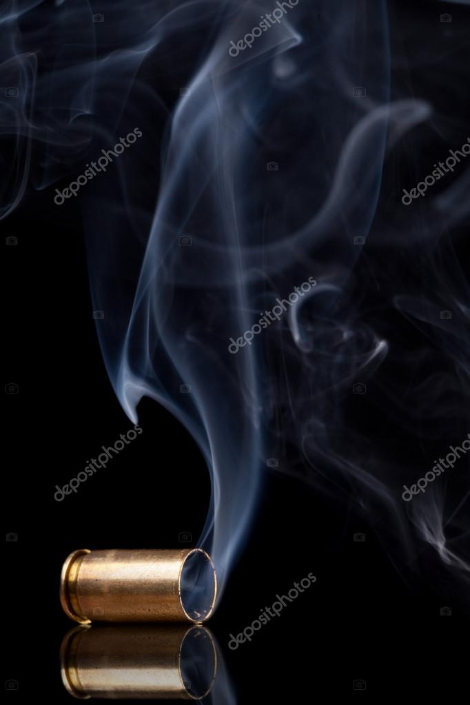 Smoking bullet casing — Stock Photo © shawn_hempel #18719575
