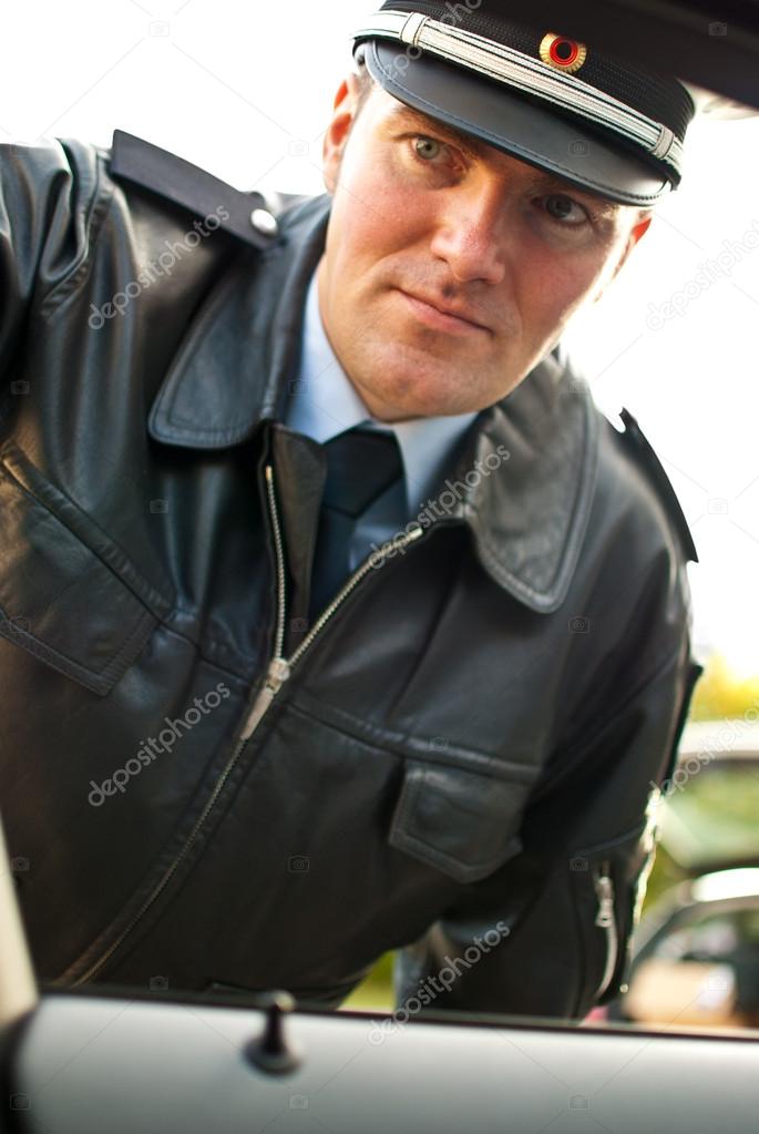 Police officer is looking into camera Stock Photo by ©mattomedia 19022197