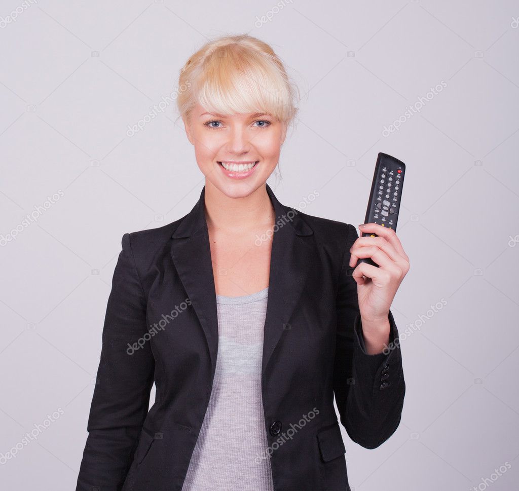 Blonde women with remote control Stock Photo by ©suzi4ka 21522453