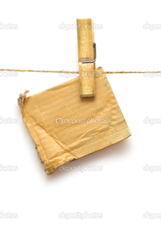 Ripped cardboard piece paper note on rope Stock Photo by ©daffodil 24391015