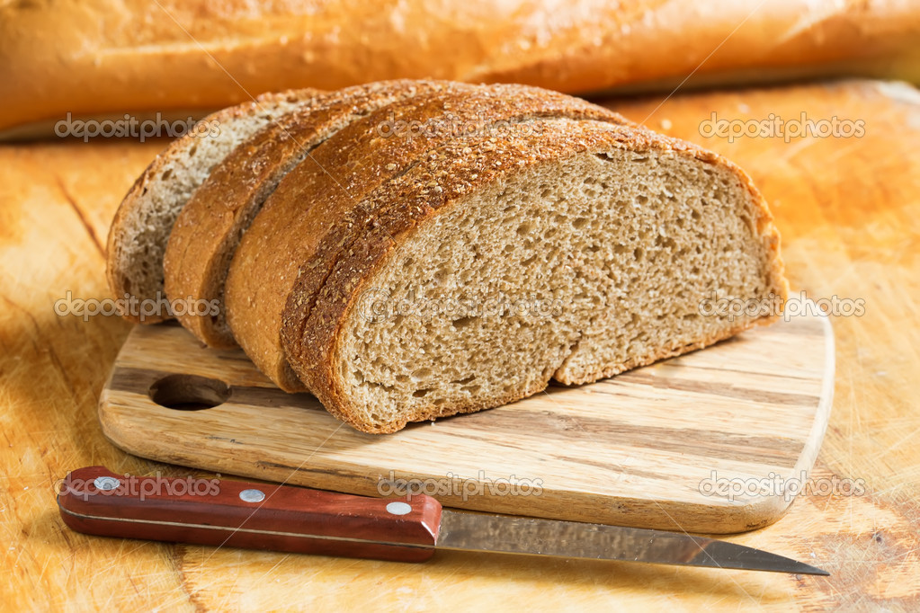 Sliced loaf of bread — Stock Photo © daffodil #25944559
