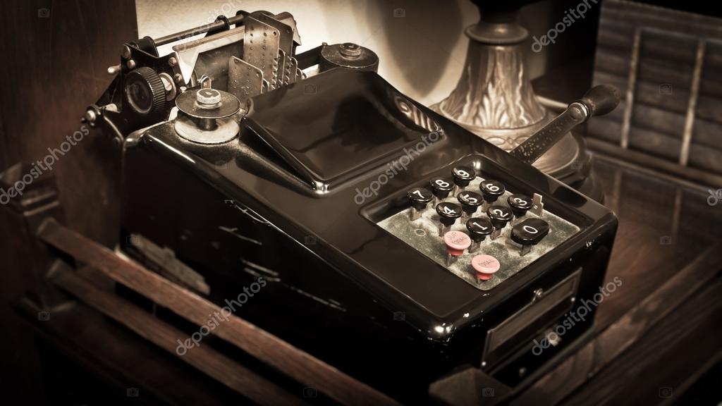 Vintage manual calculator machine Stock Photo by ©cowardlion 31616207