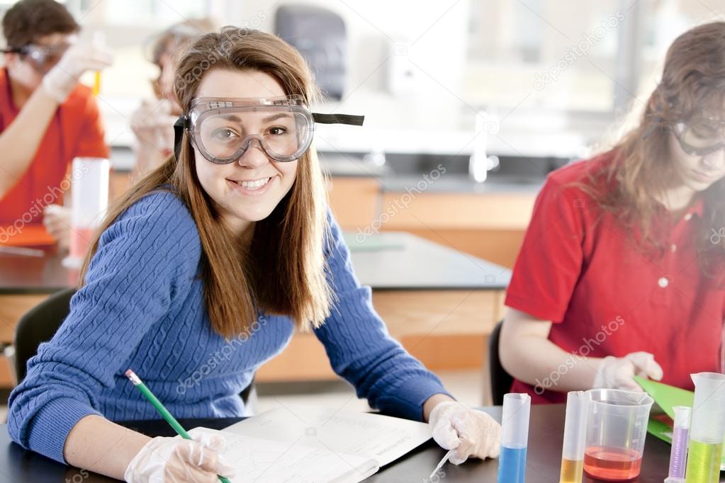 School Science. Caucasian students learning about chemistry in science ...