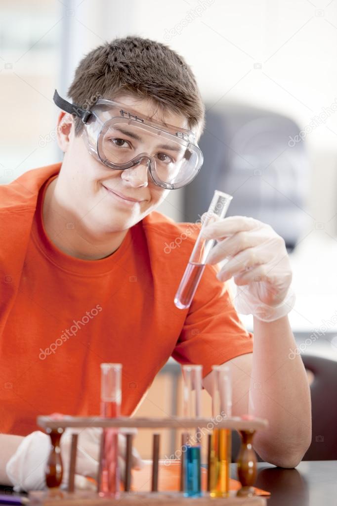 School Science. Hispanic teenage high school student learning about ...
