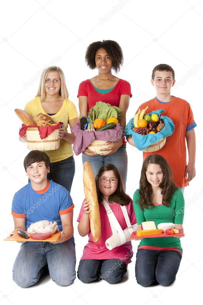 Healthy Eating. Diverse group of teenage girls and boys holding baskets ...