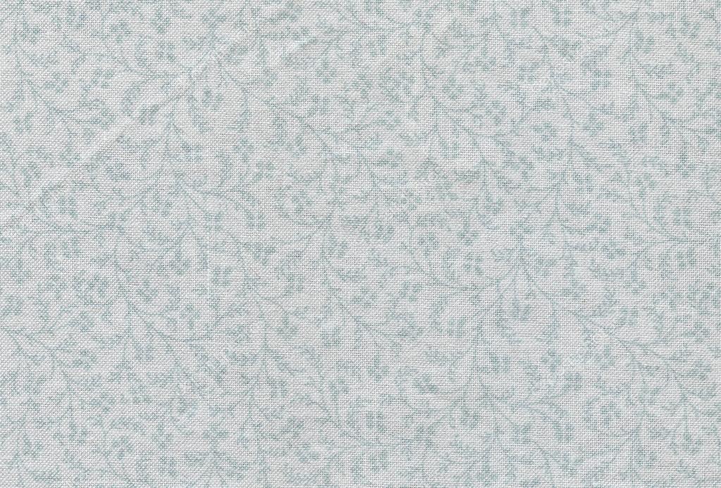 A high resolution delicate blue floral pattern printed on white fabric ...