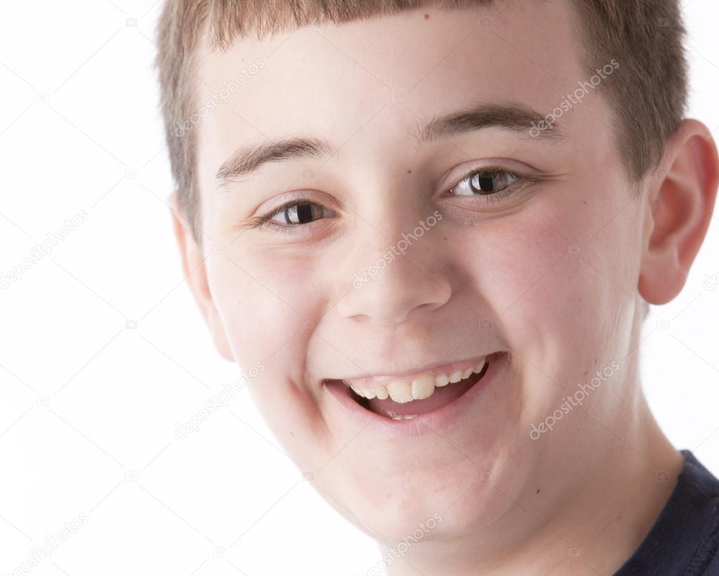 A closeup headshot of a 12 year old caucasian smiling little real boy ...