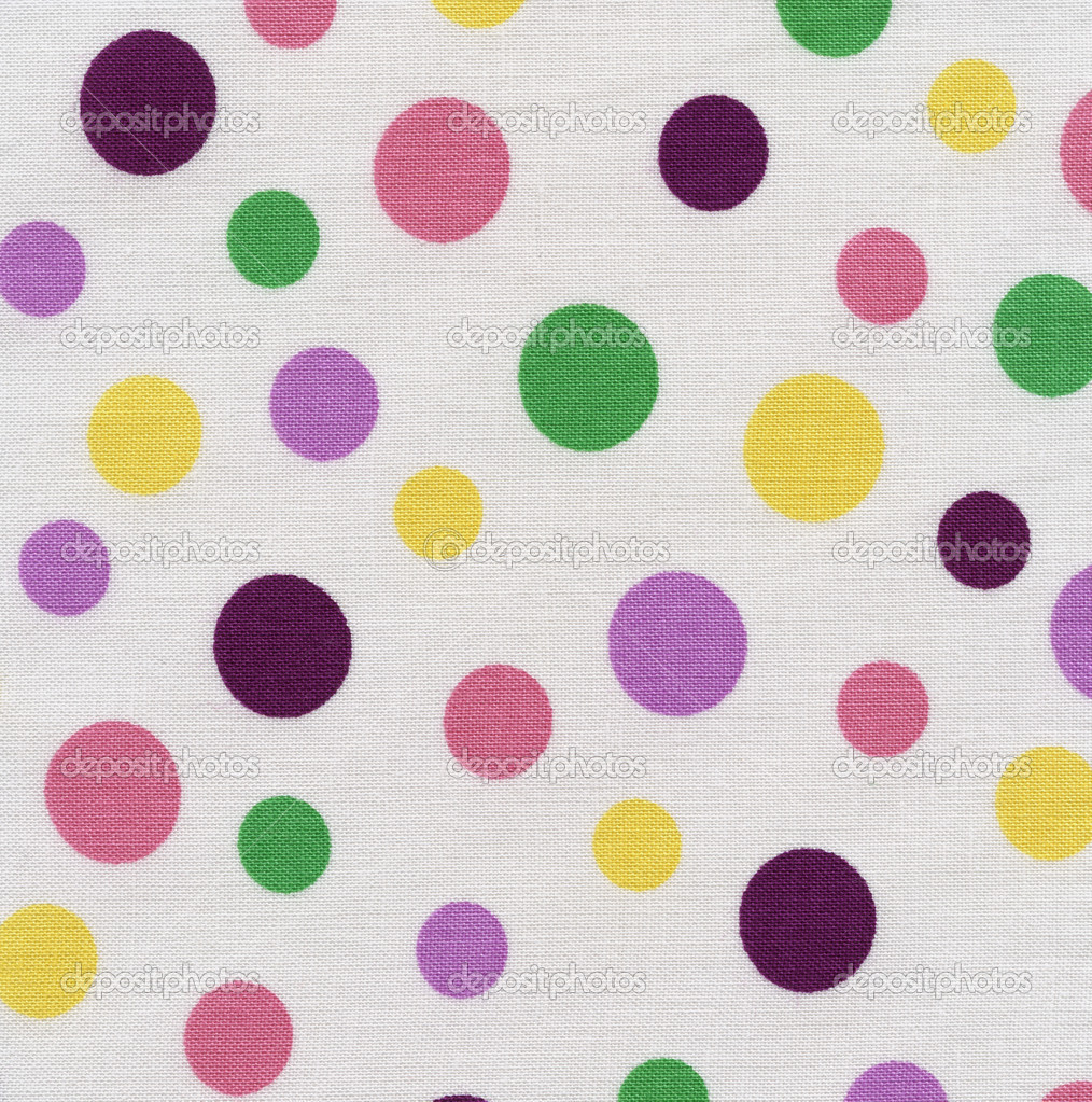 A high resolution white fabric with bright multi-colored polka dots ...
