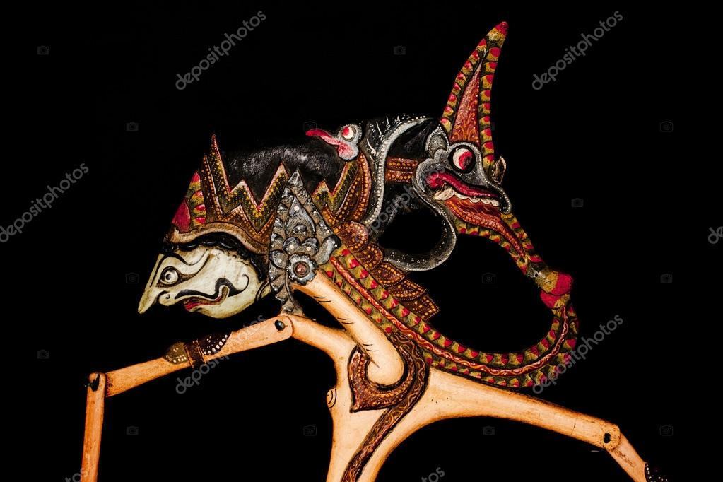 Traditional Indonesian wayang with batik motif on black background ...