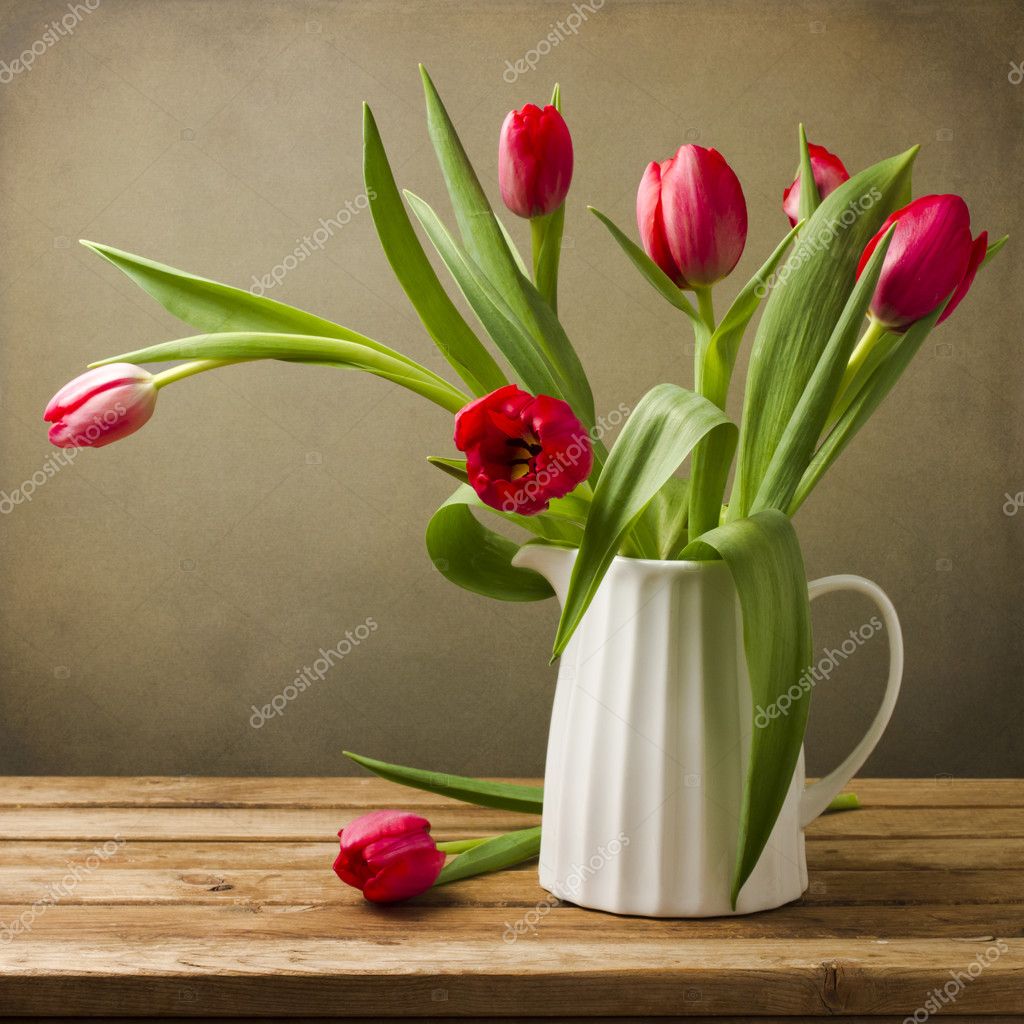 Still life with tulips bouquet on wooden table Stock Photo by ©maglara ...