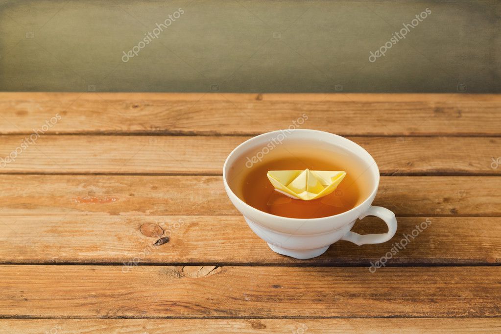 Tea cup with paper origami boat — Stock Photo © maglara #26183335