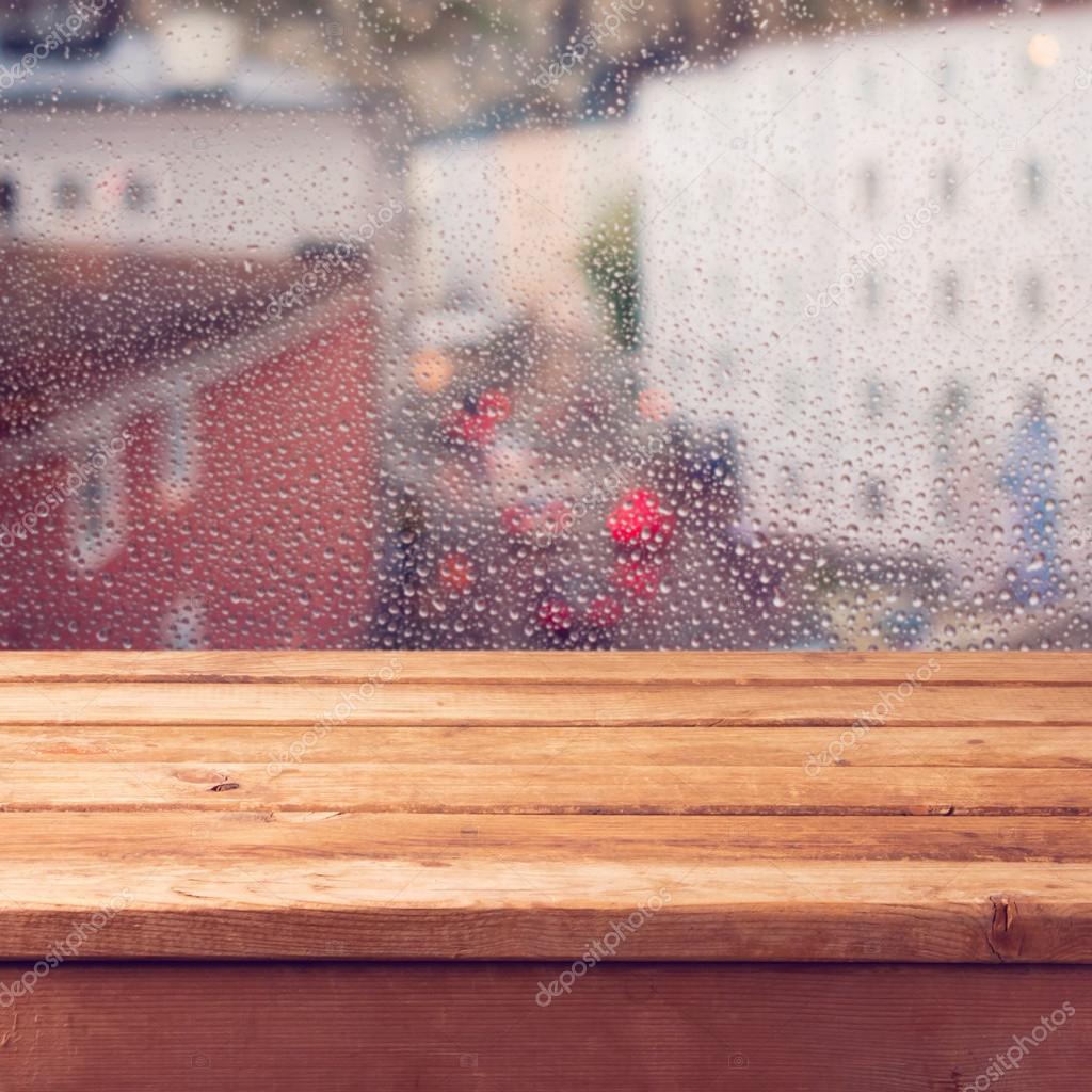 Table over window with rain drops Stock Photo by ©maglara 39497731