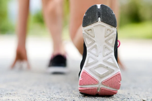 Runner feet running on road closeup on shoe - Stock Image - Everypixel