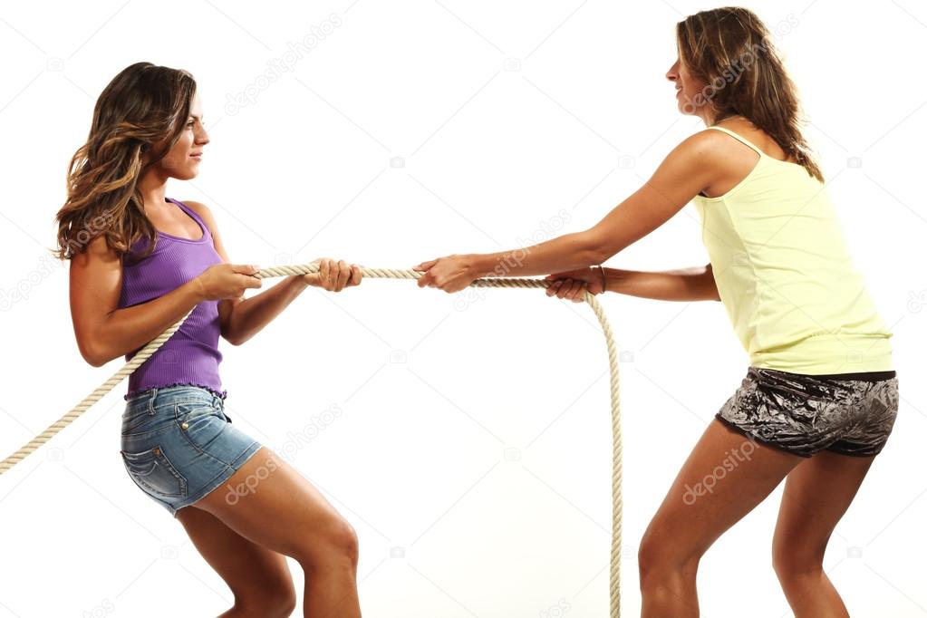 Beautiful girls pull the rope Stock Photo by ©Zveiger 30809949
