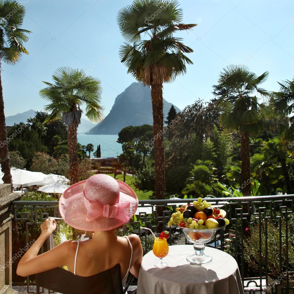 Beautiful woman on the terrace — Stock Photo © Zveiger #48097119