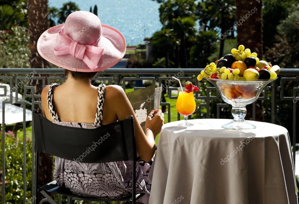 Beautiful woman on the terrace — Stock Photo © Zveiger #48101427