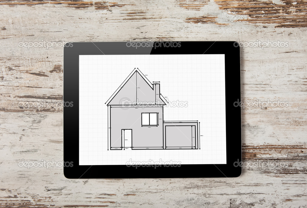 Tablet with drawing of apartment house on the screen on a backgr ...