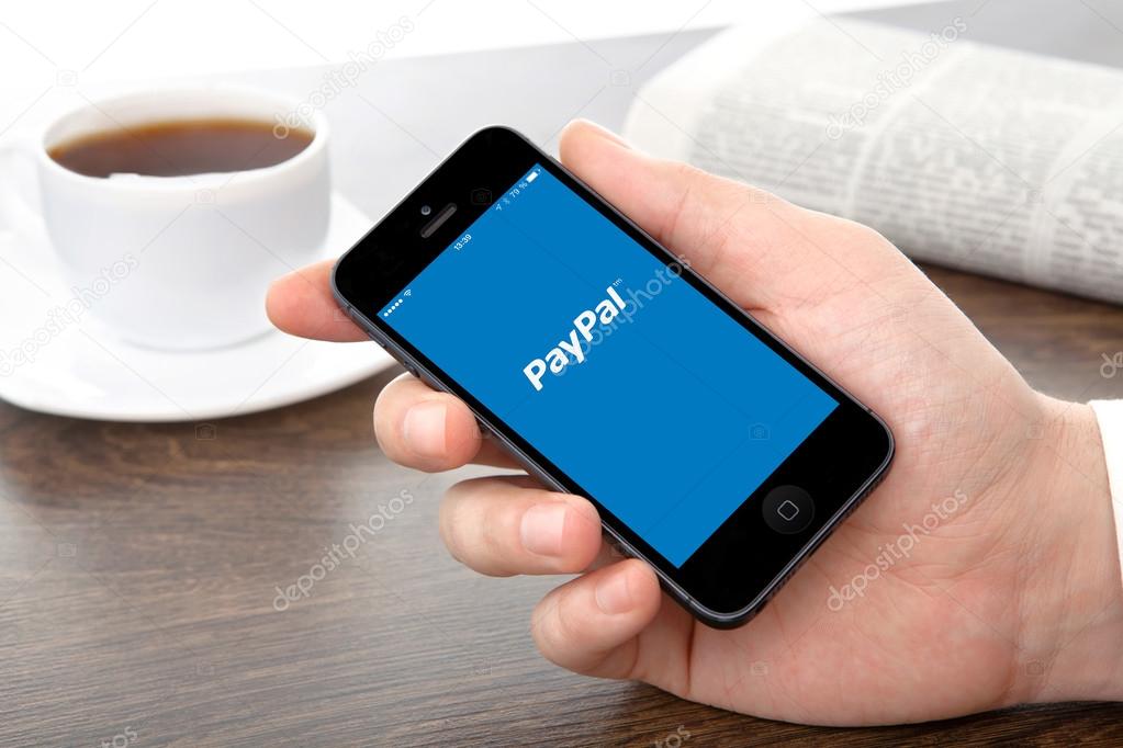 Male hand holding a iPhone with app PayPal on a screen – Stock ...