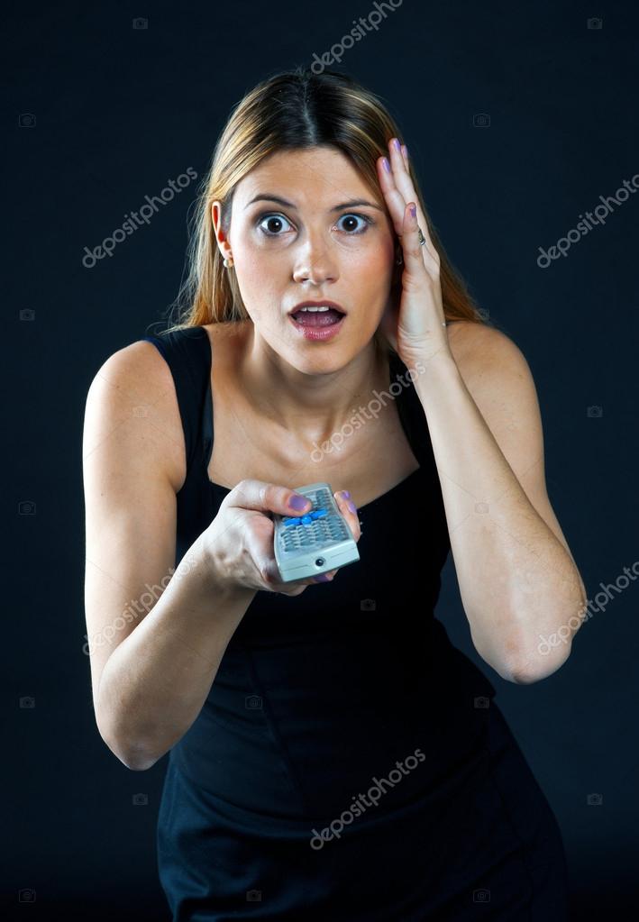 Woman with remote control — Stock Photo © bertys30 #20425245 Woman with remote control — Stock Photo © bertys30 #20425245