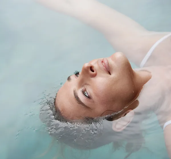 Portrait Young Woman Sitting Swimming Pool Stock Photo by ©YAYImages ...