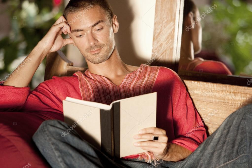 Attractive man reading a book — Stock Photo © mjth #21101955