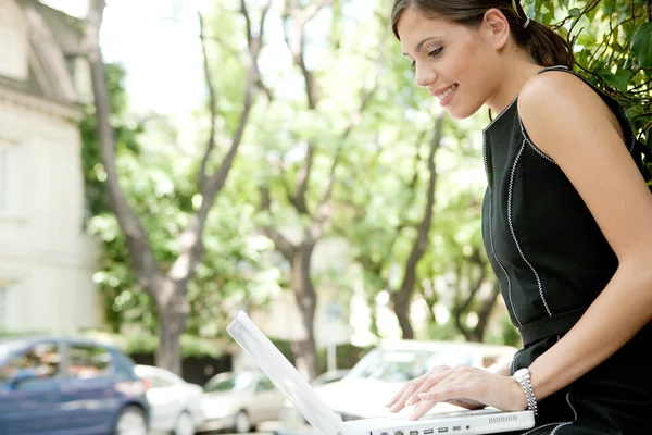 attractive businesswoman using a laptop computer - Stock Image - Everypixel
