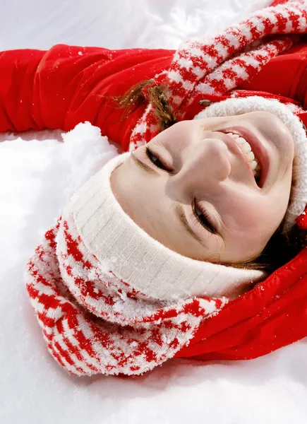 Woman laying down on the snow - Stock Image - Everypixel