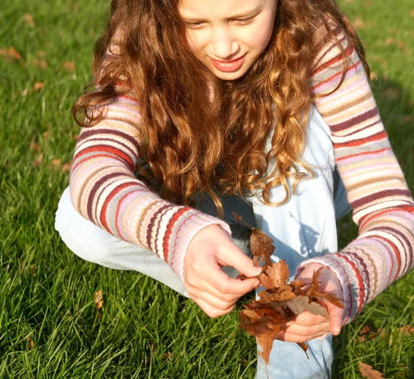 Young child girl crouching Stock Photo by ©mjth 46730785